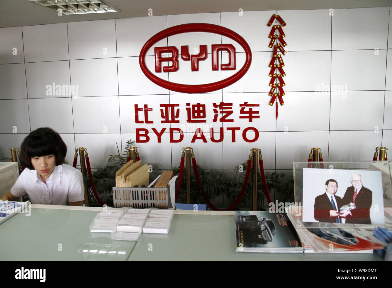 --FILE--A Chinese staff is pictured at a BYD dealership in Nanjing city ...