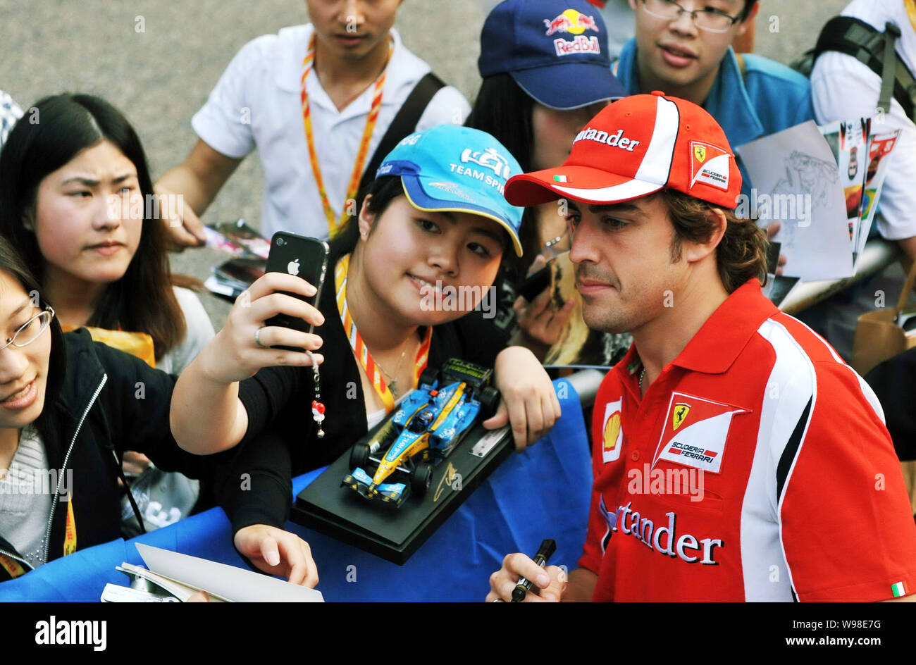 Spanish F1 driver Fernando Alonso of the Ferrari team poses for photos ...