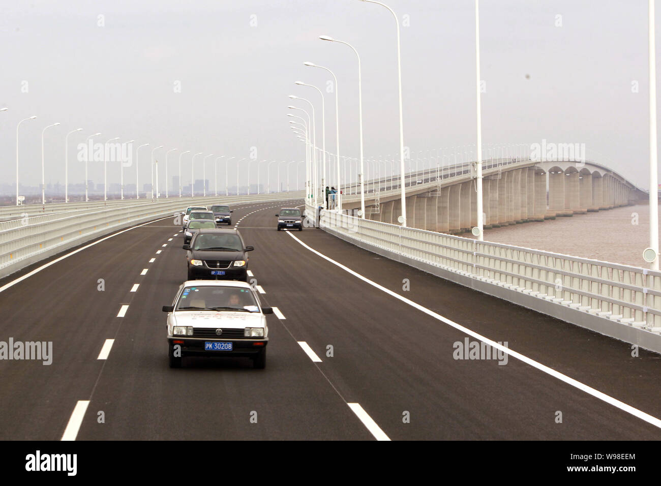 Cars are seen on the Yangtze River bridge linking Shanghais Chongming ...