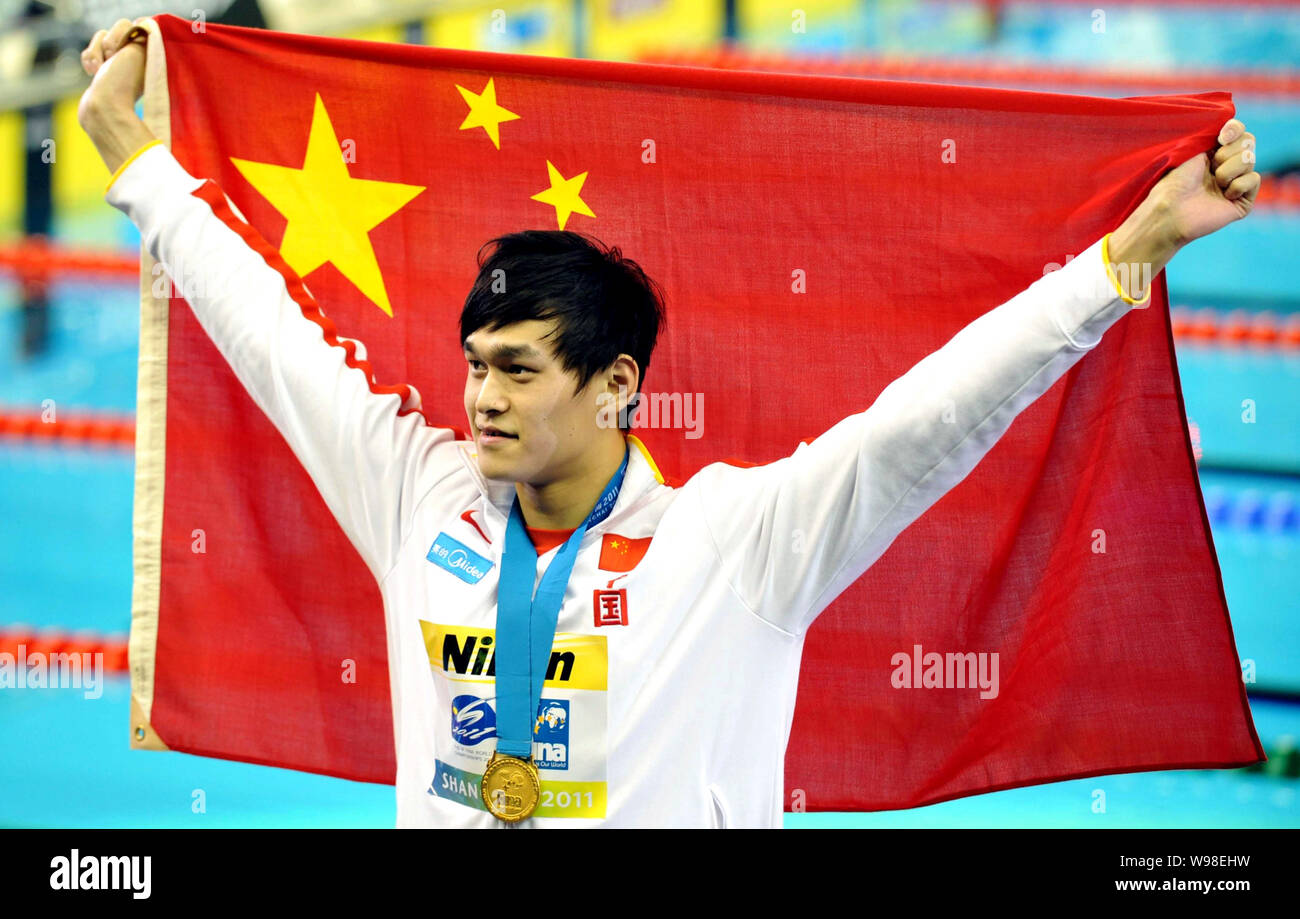 Gold medalist Sun Yang of China celebrates after the award ceremony for ...