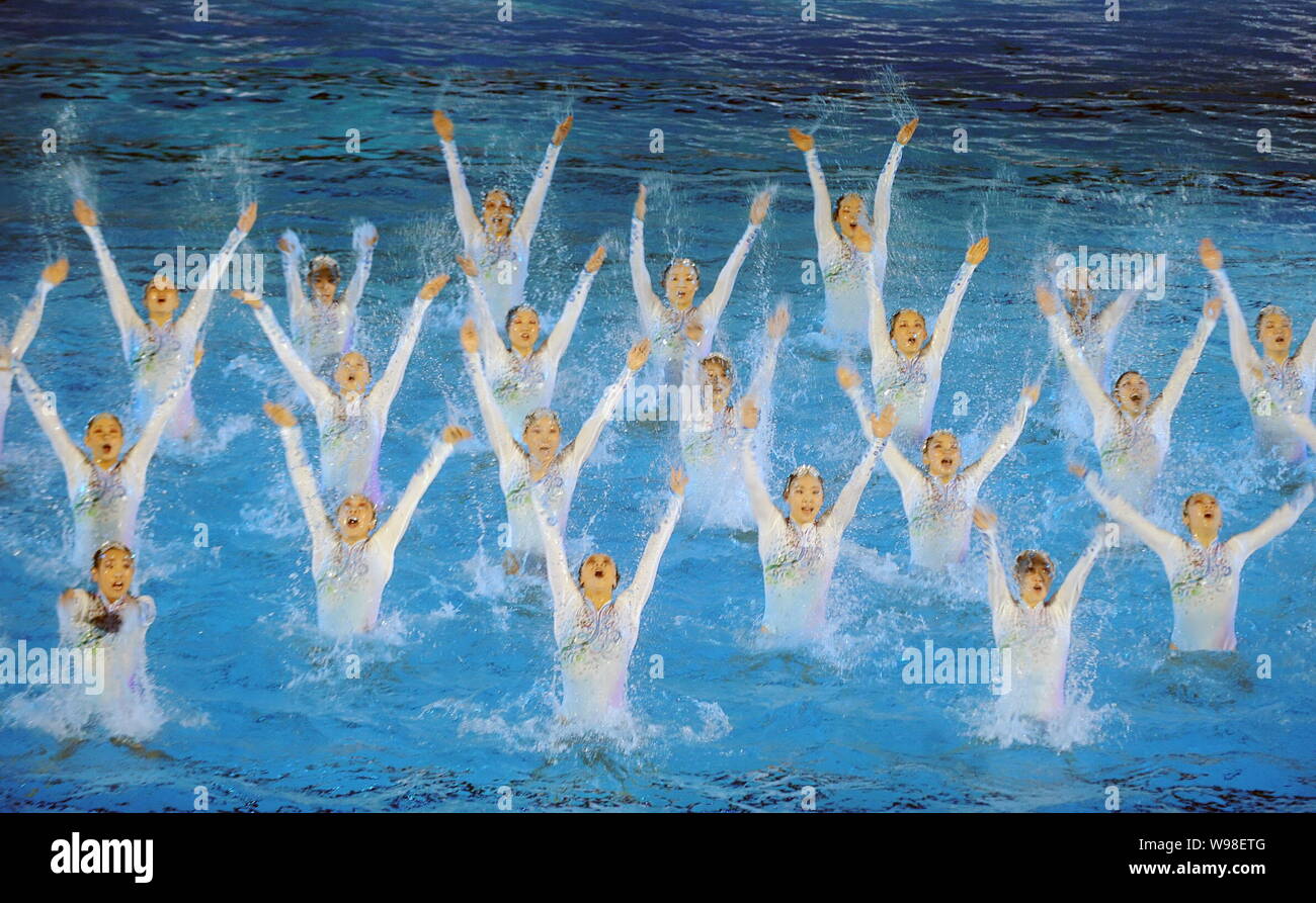 Performers dance during the opening rehearsal of the Swimming World ...