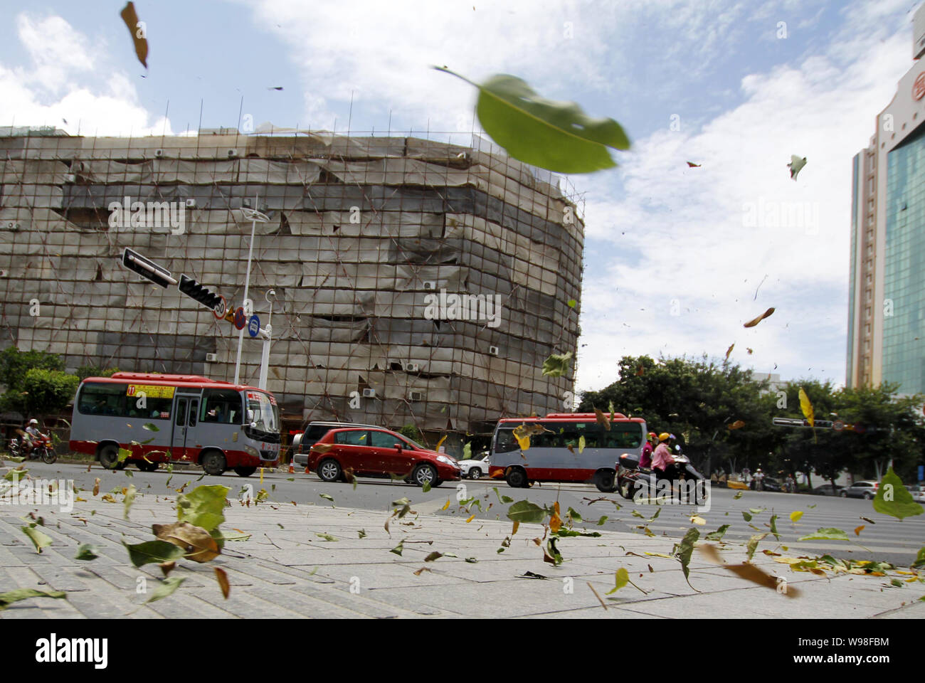 Fallen leaves are blown away by strong wind caused by Typhoon Nanmadol ...