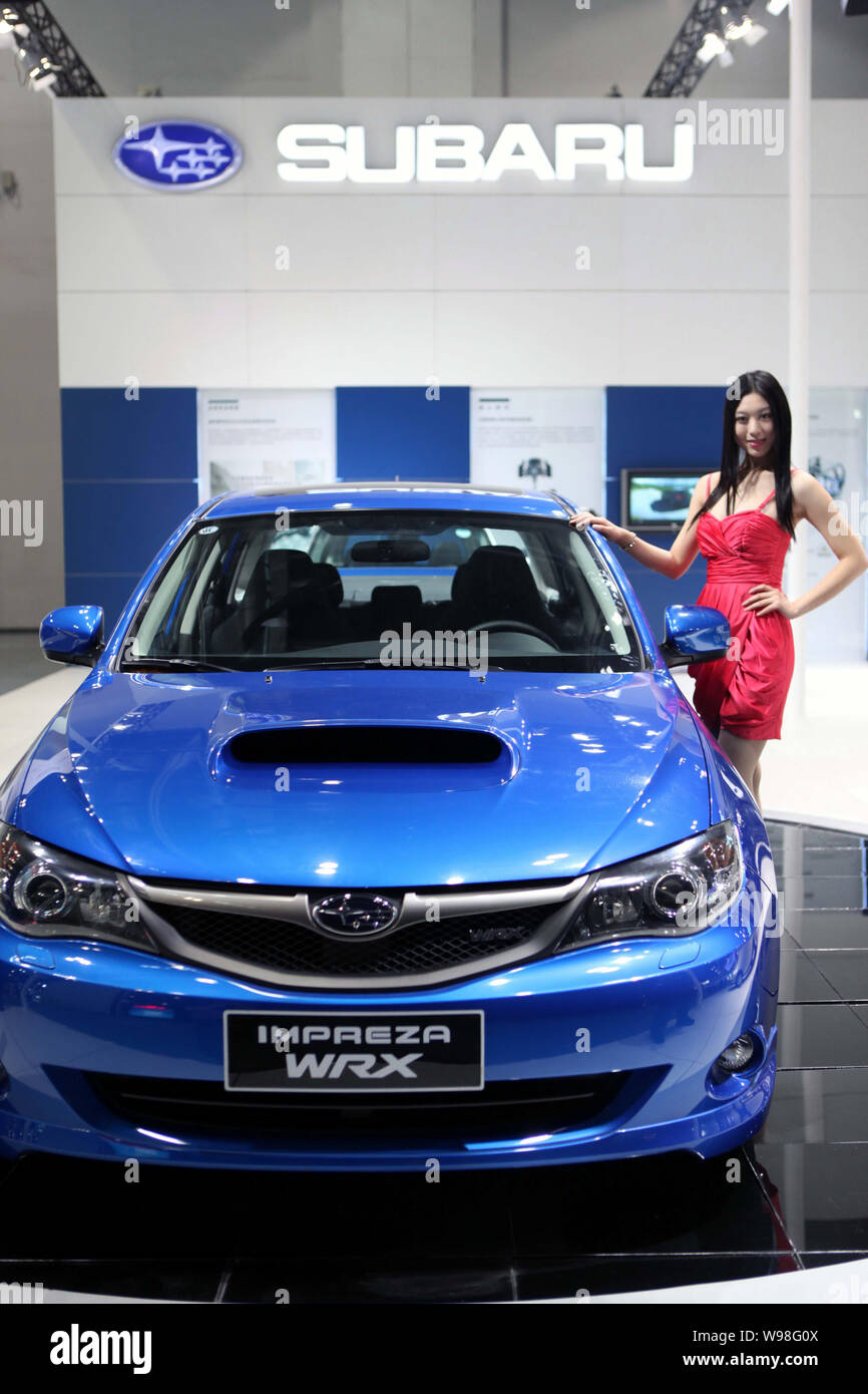 A model poses with a Subaru Impreza WRX during the 2011 China Beijing ...