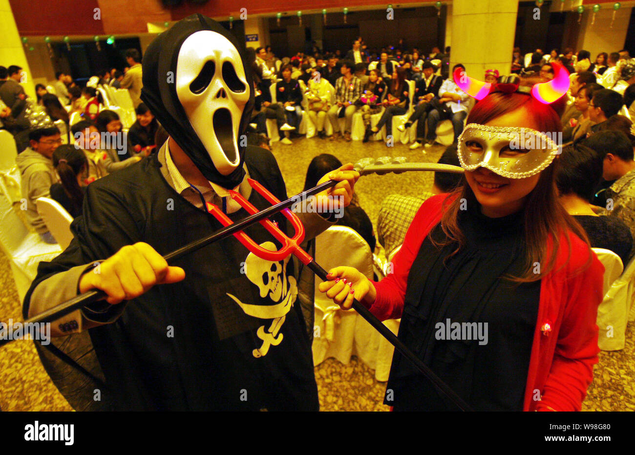 Young Chinese people dressed in ghost and monster costumes attend a ...