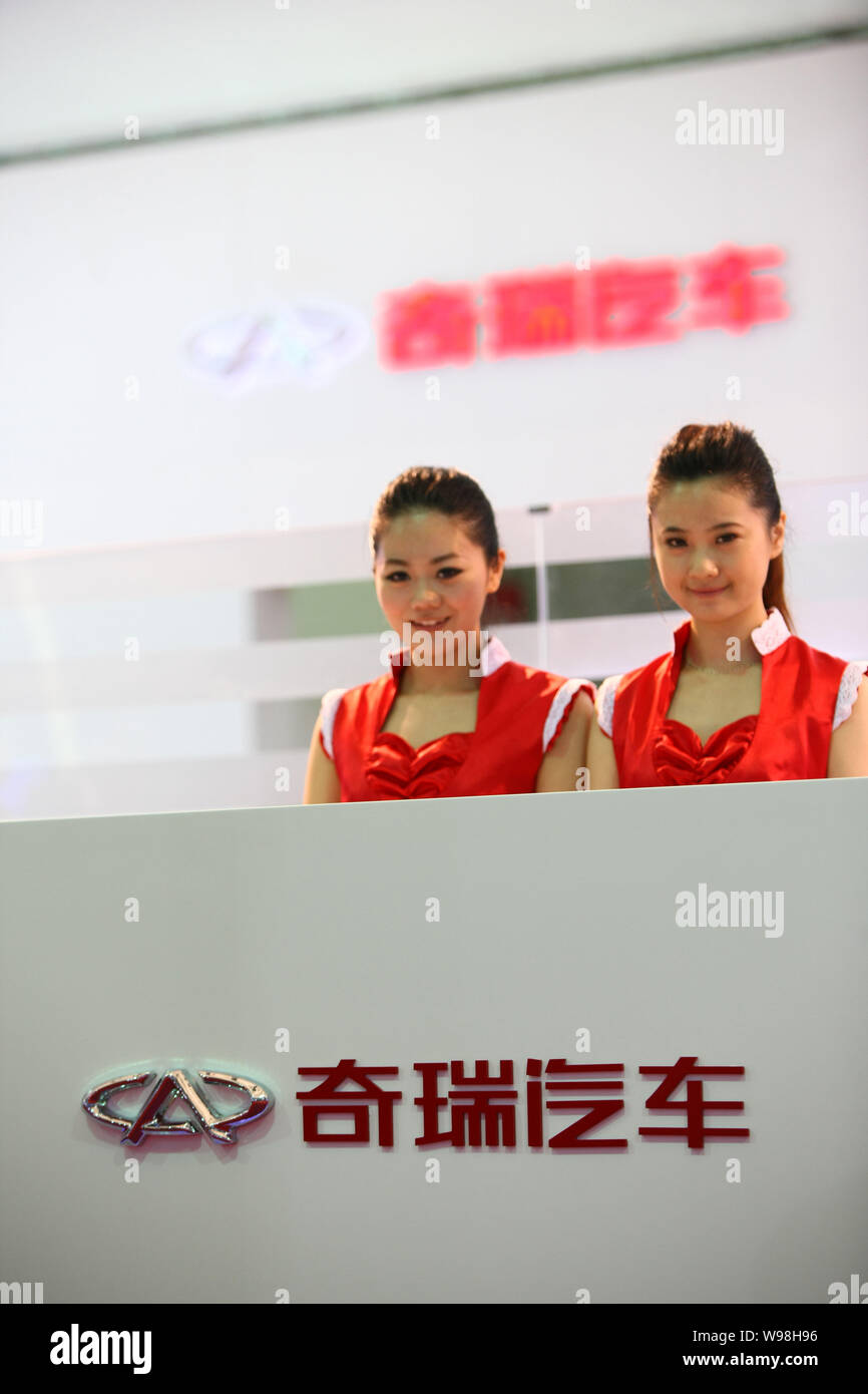 --FILE--Two Chinese staff work behind the counter at the booth of Chery ...