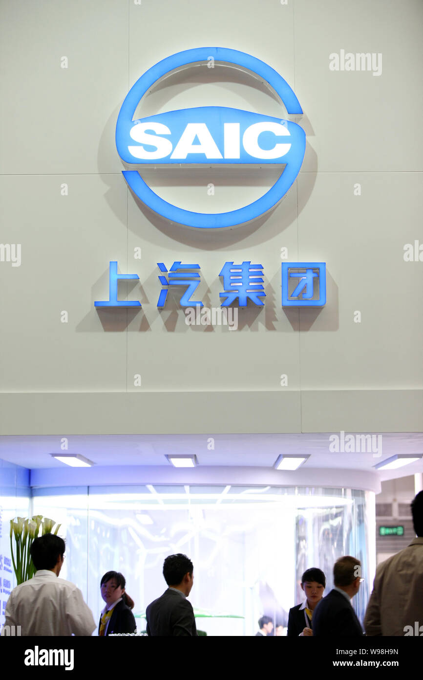 --FILE--Visitors walk past the booth of SAIC (Shanghai Automotive ...