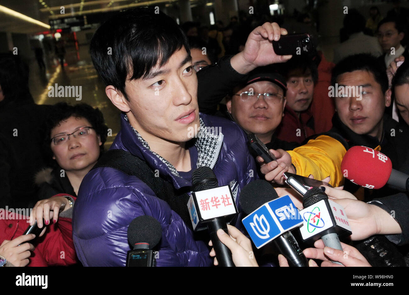 Chinese star hurdler Liu Xiang is interviewed after arriving at the ...