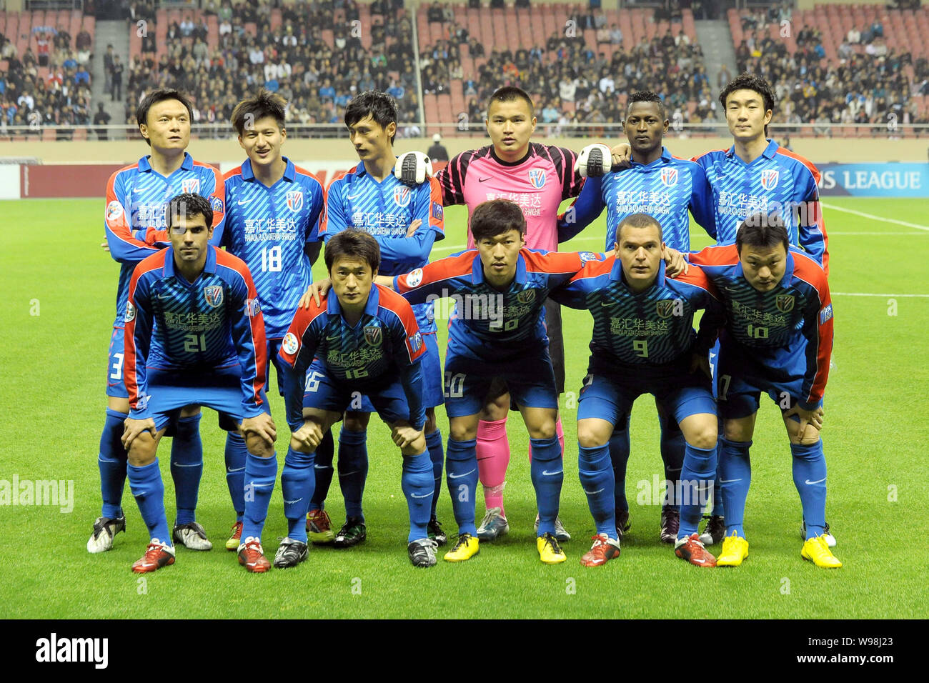 Soccer players of Chinas Shanghai Shenhua pose for photos before ...