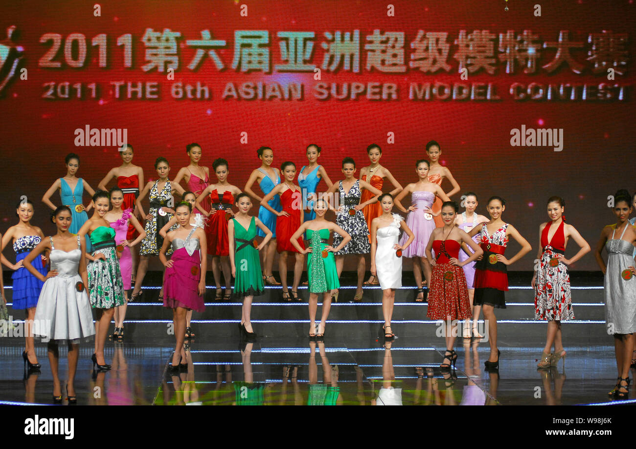 Models wearing garments with Chinese elements pose on the stage during ...