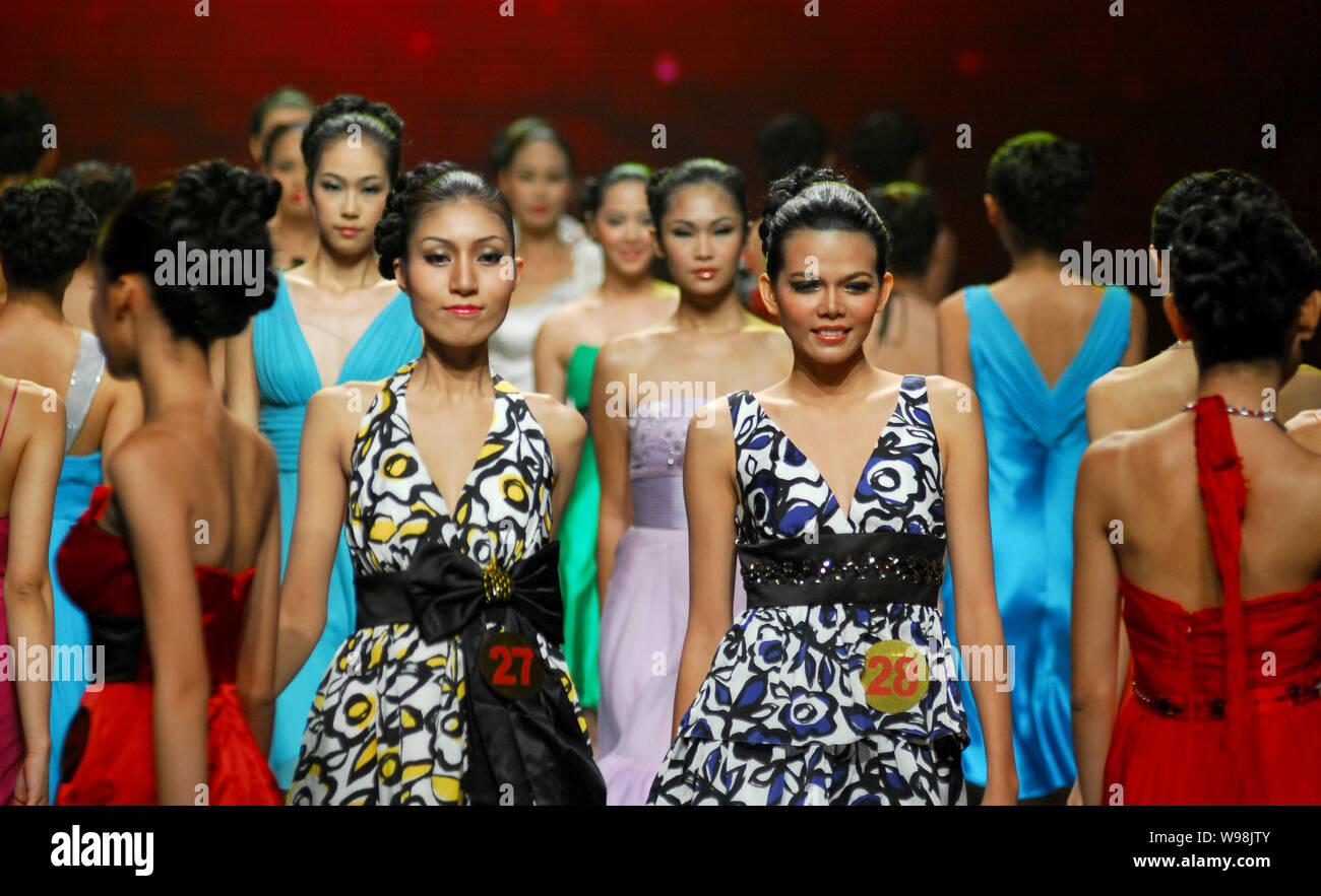 Models wearing garments with Chinese elements pose on the stage during ...