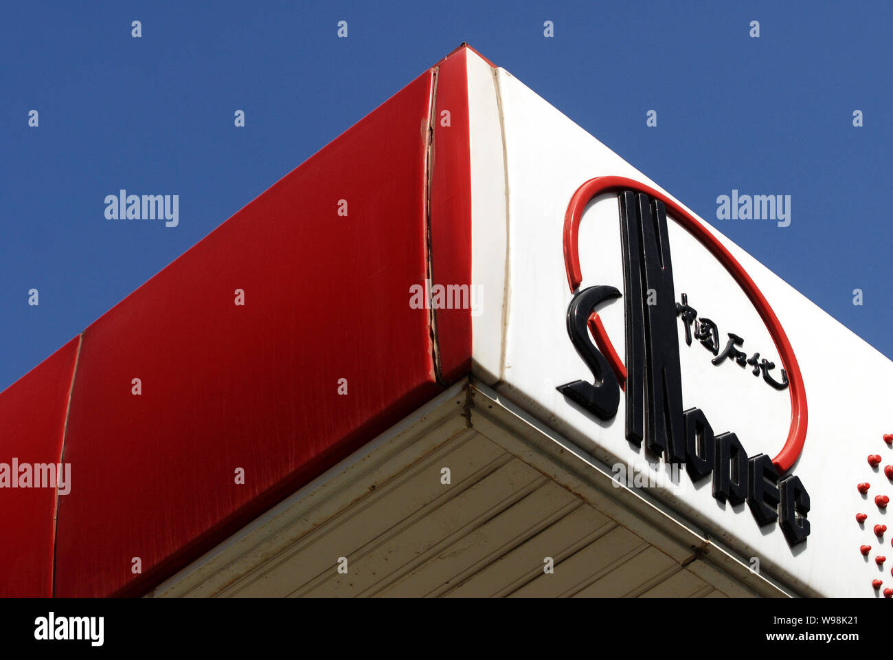 --FILE--The signage of of Sinopec is pictured at a gas station of ...