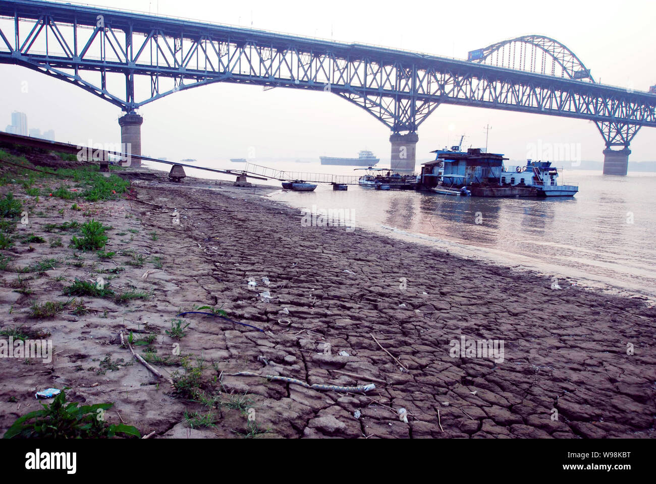 This photo shows the riverbed full of cracks due to a severe drought ...