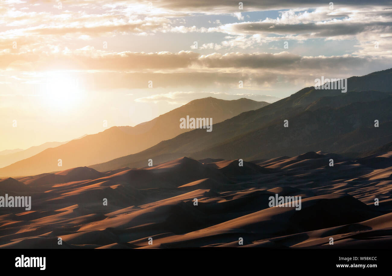 Sunlight shining over Great Sand Dunes National Park in the Colorado ...