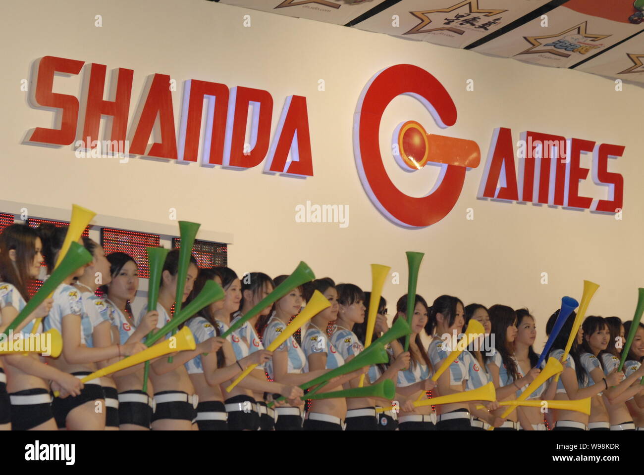 --File--Models hold vuvuzelas at the stand of Shanda Games during the ...