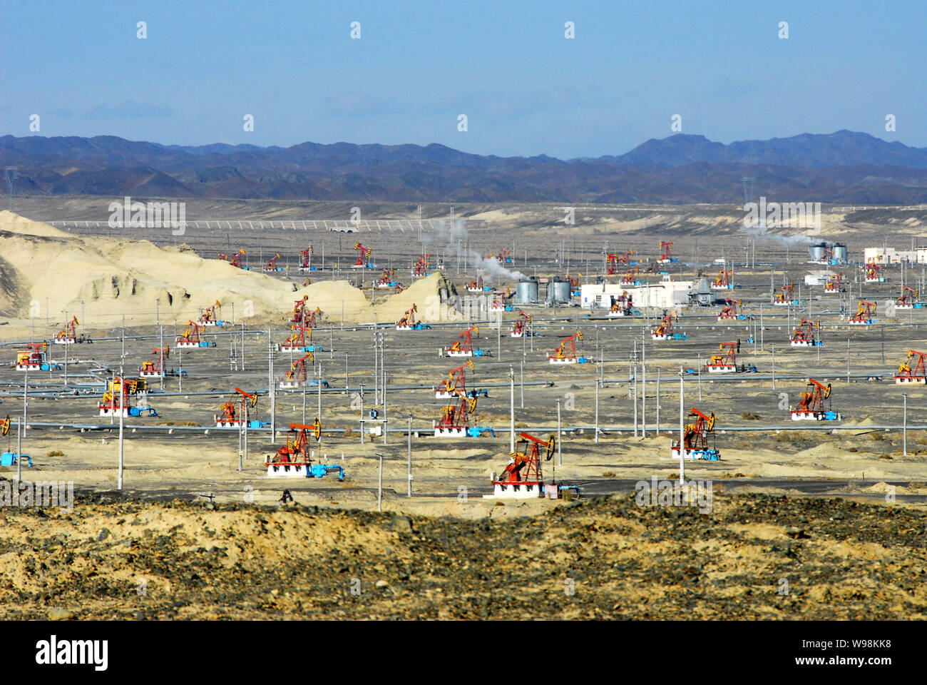 --FILE--Derricks pump crude oil in the Karamay oil field of CNPC (China ...