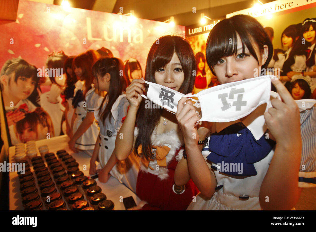 Cosplay girls pose during the opening ceremony of Japan Anime Festival ...