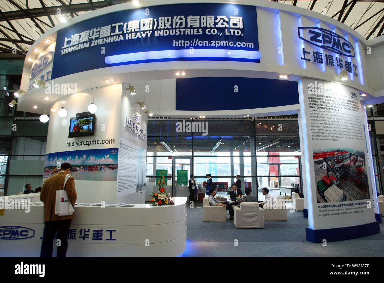 Visitors are seen at a stand of ZPMC (Shanghai Zhenhua Heavy Industries ...