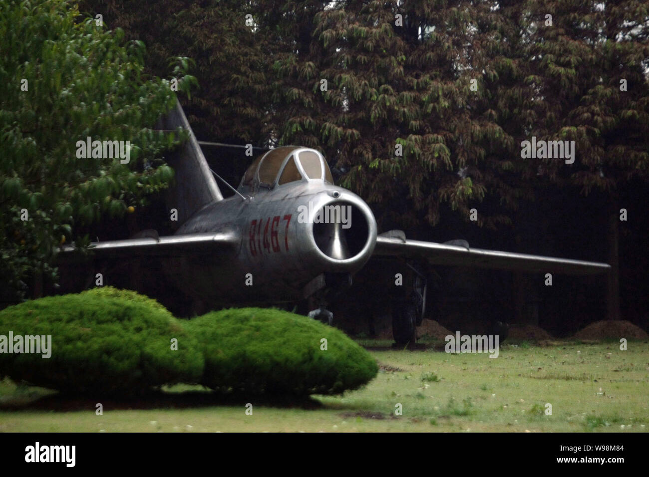 View of the J-5 jet fighter parked in a garden of a mansion in Shanghai ...