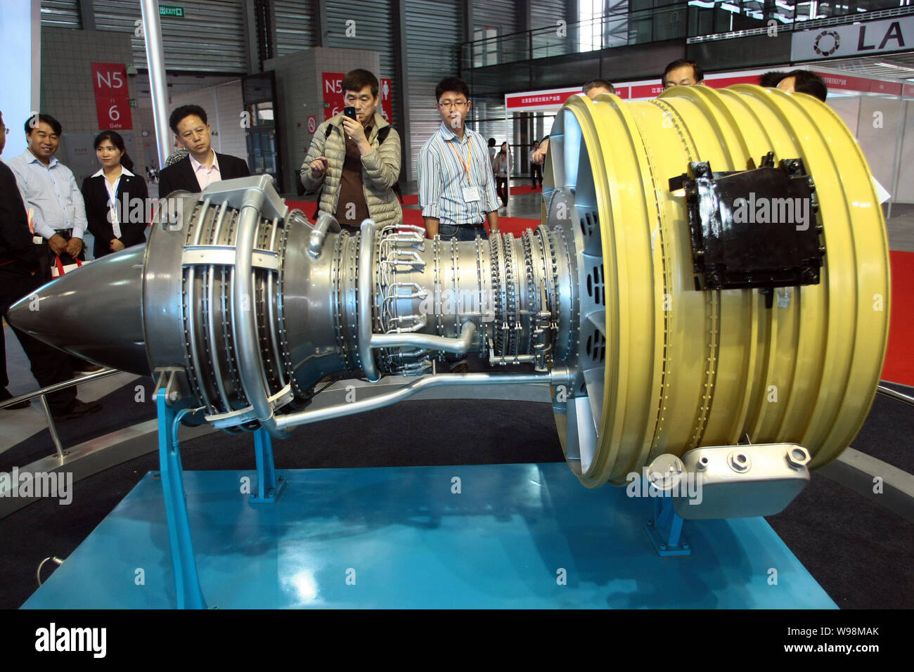 Visitors look at a turbofan engine to be used on Chinas first jumbo jet ...