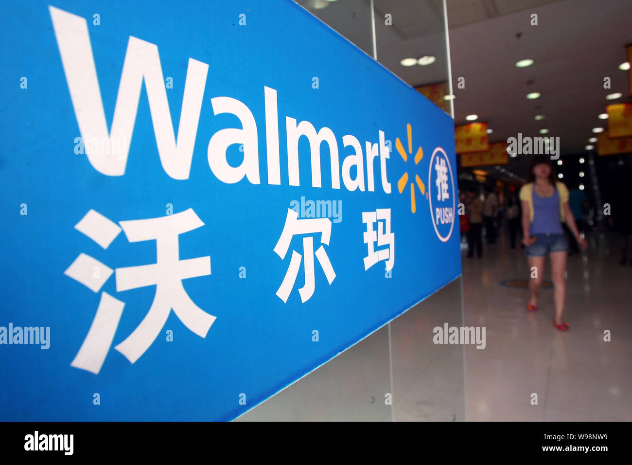 --FILE--Shoppers are pictured at a Wal-Mart (Walmart) supermarket in ...