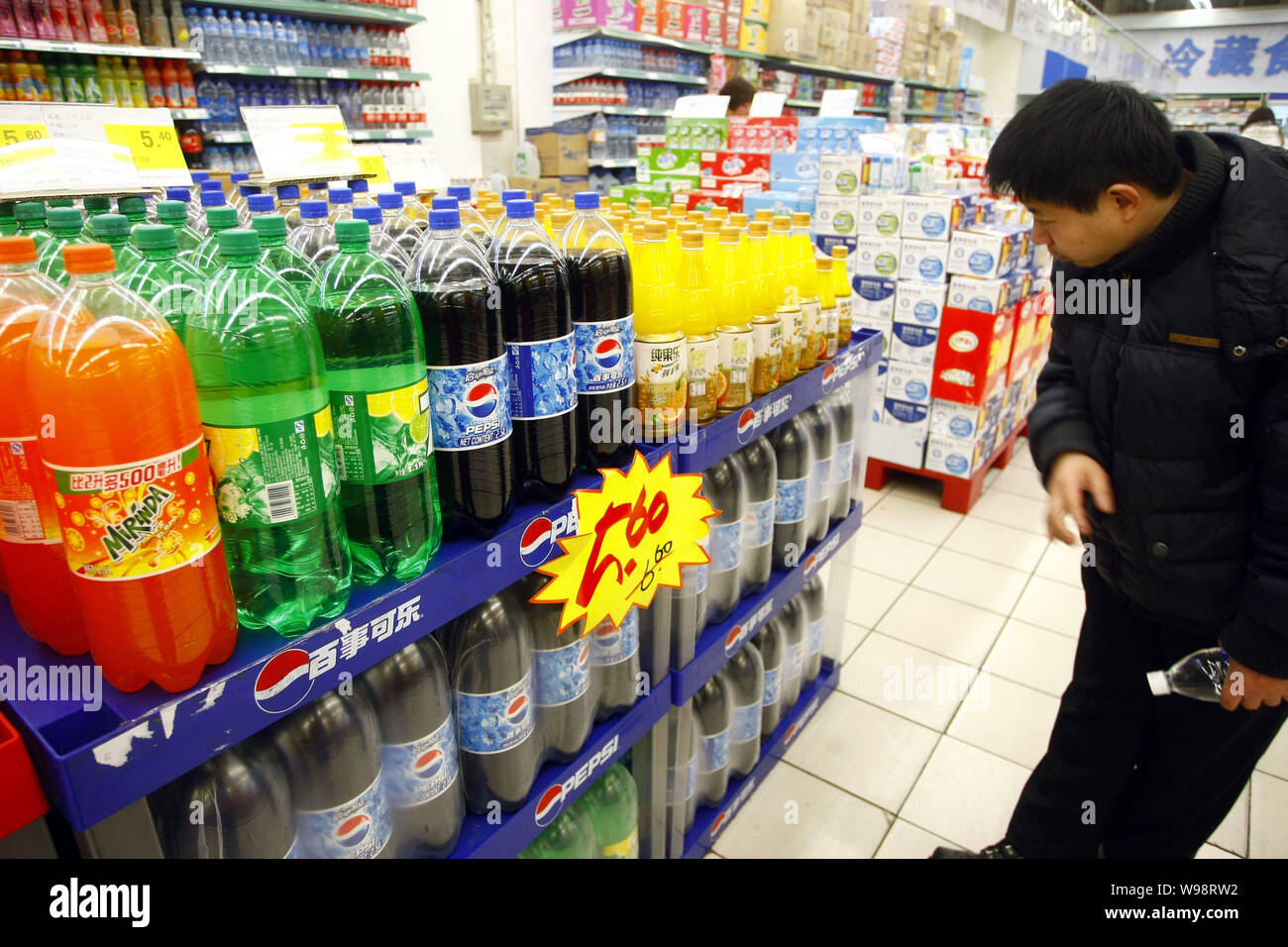 A Chinese customer shops for beverages of PepsiCo at a supermarket in ...