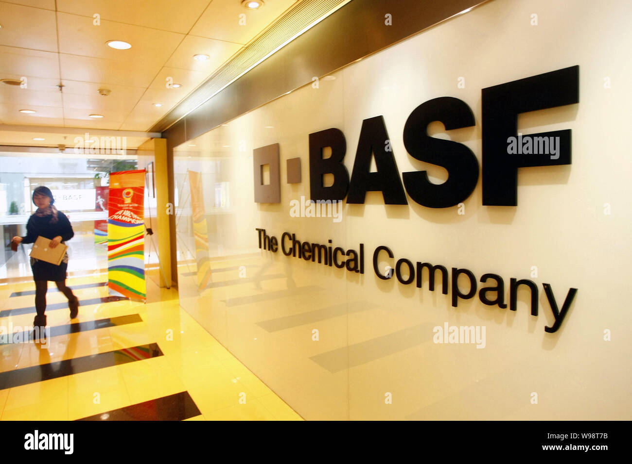 A Chinese staff is seen at the head office of BASF (China) Co., Ltd. in ...