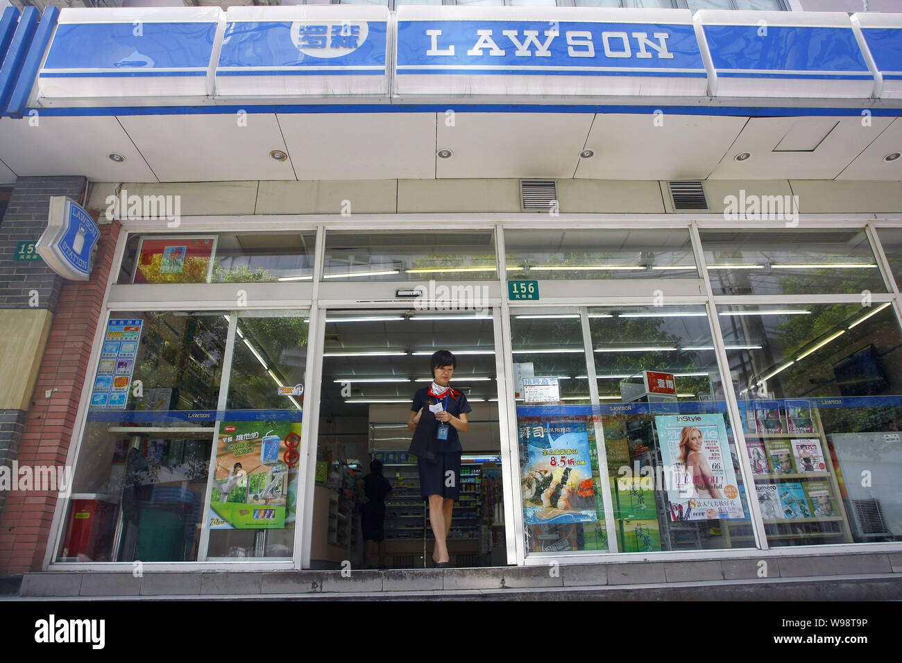 --File--A Chinese customer walks out of a Lawson convenience store in ...