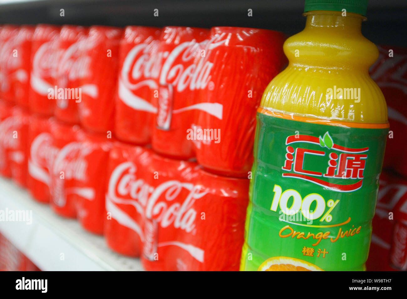 --File-- Bottles of Huiyuan juice and cans of Coca-Cola coke are seen ...