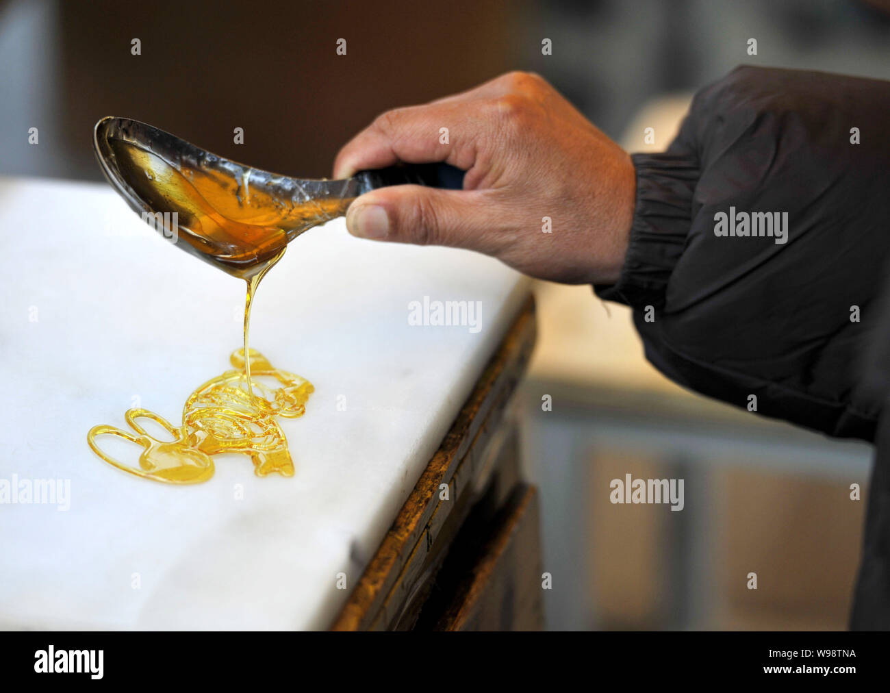 A Chinese craftsman makes a candied rabbit to celebrate the upcoming ...