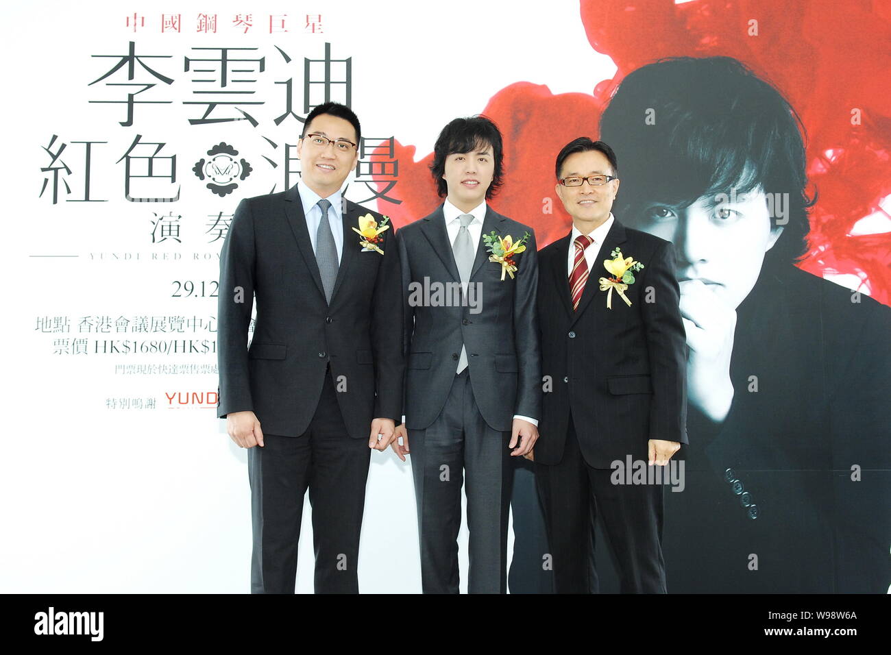 Chinese pianist Li Yundi (C) is pictured during a press conference for ...