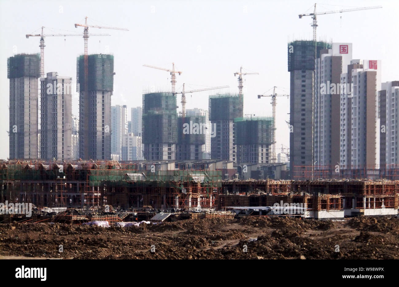 A cluster of residential apartment buildings and villas are seen under ...