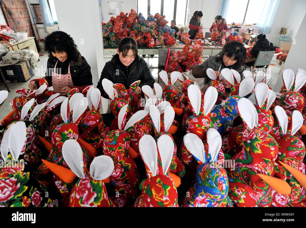 Female Chinese workers make rabbit-shaped craftworks to be exported to ...
