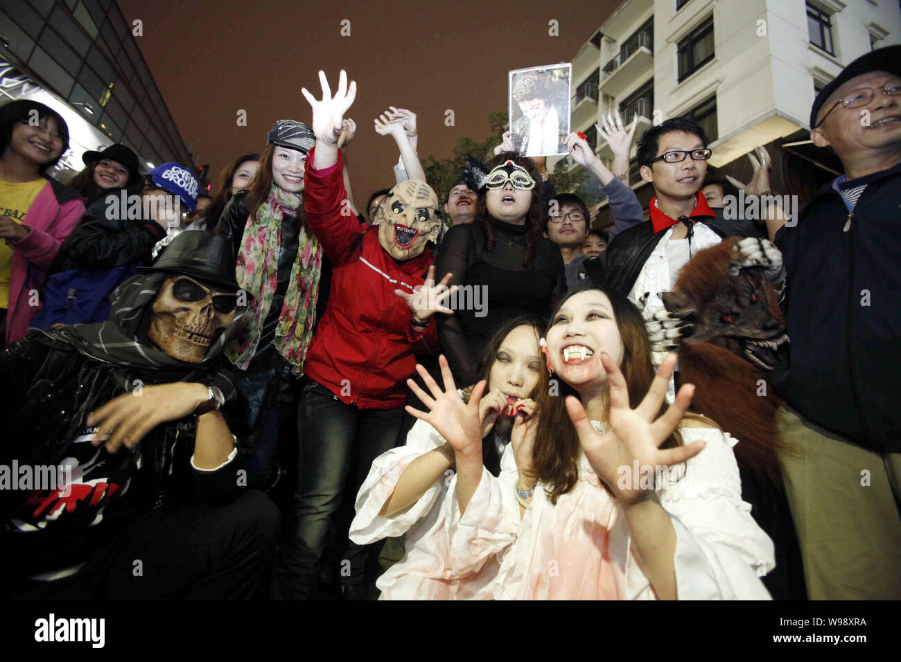 Young Chinese people dressed in ghost and monster costumes and makeup ...