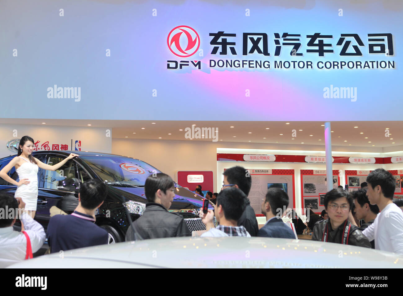 --File--Visitors look at cars at a stand of DFM (Dongfeng Motor ...
