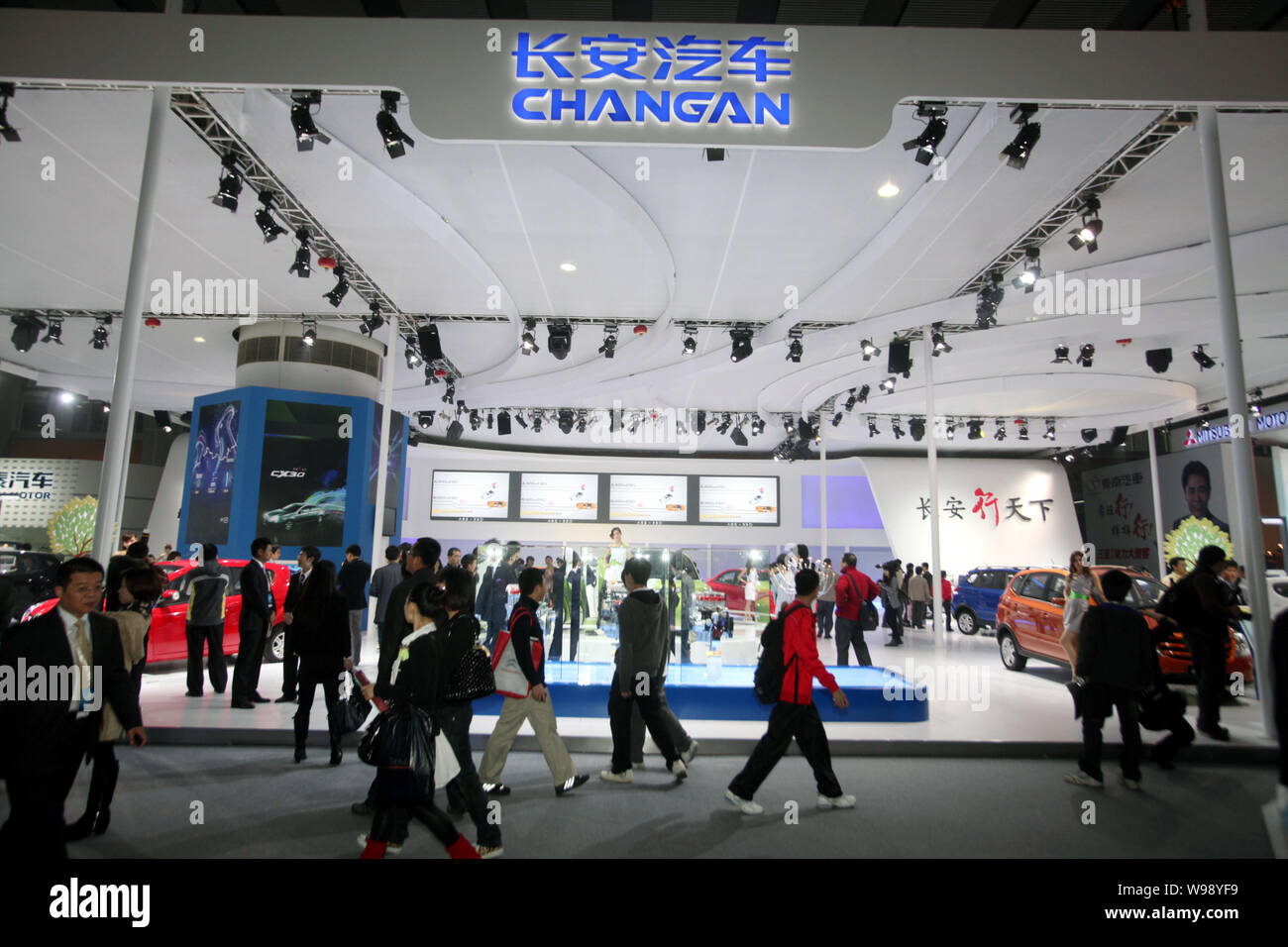 --File-- Visitors walk past the stand of Changan Automobile during an ...