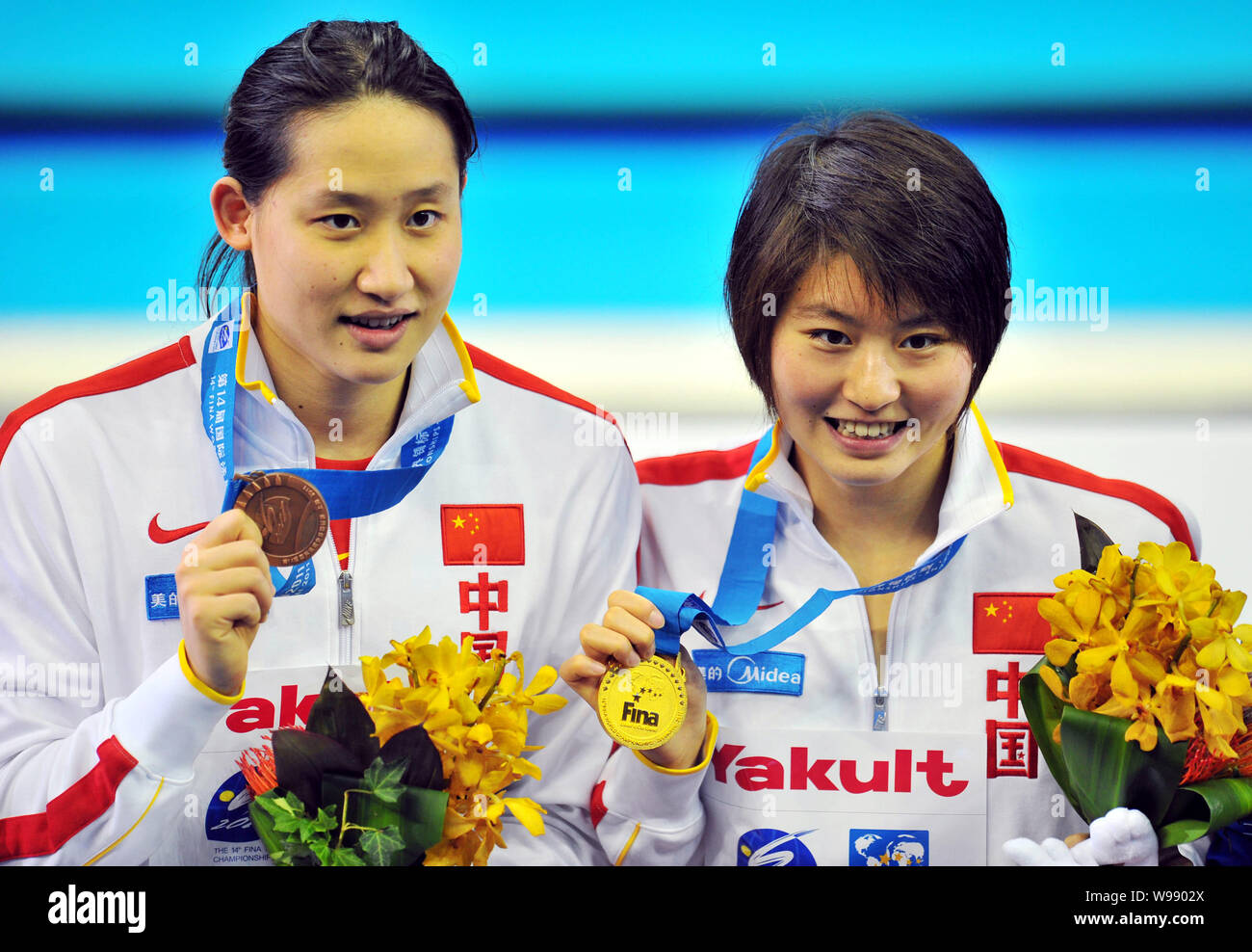 Gold medalist Jiao Liuyang, right, and bronze medalist Liu Zige of ...