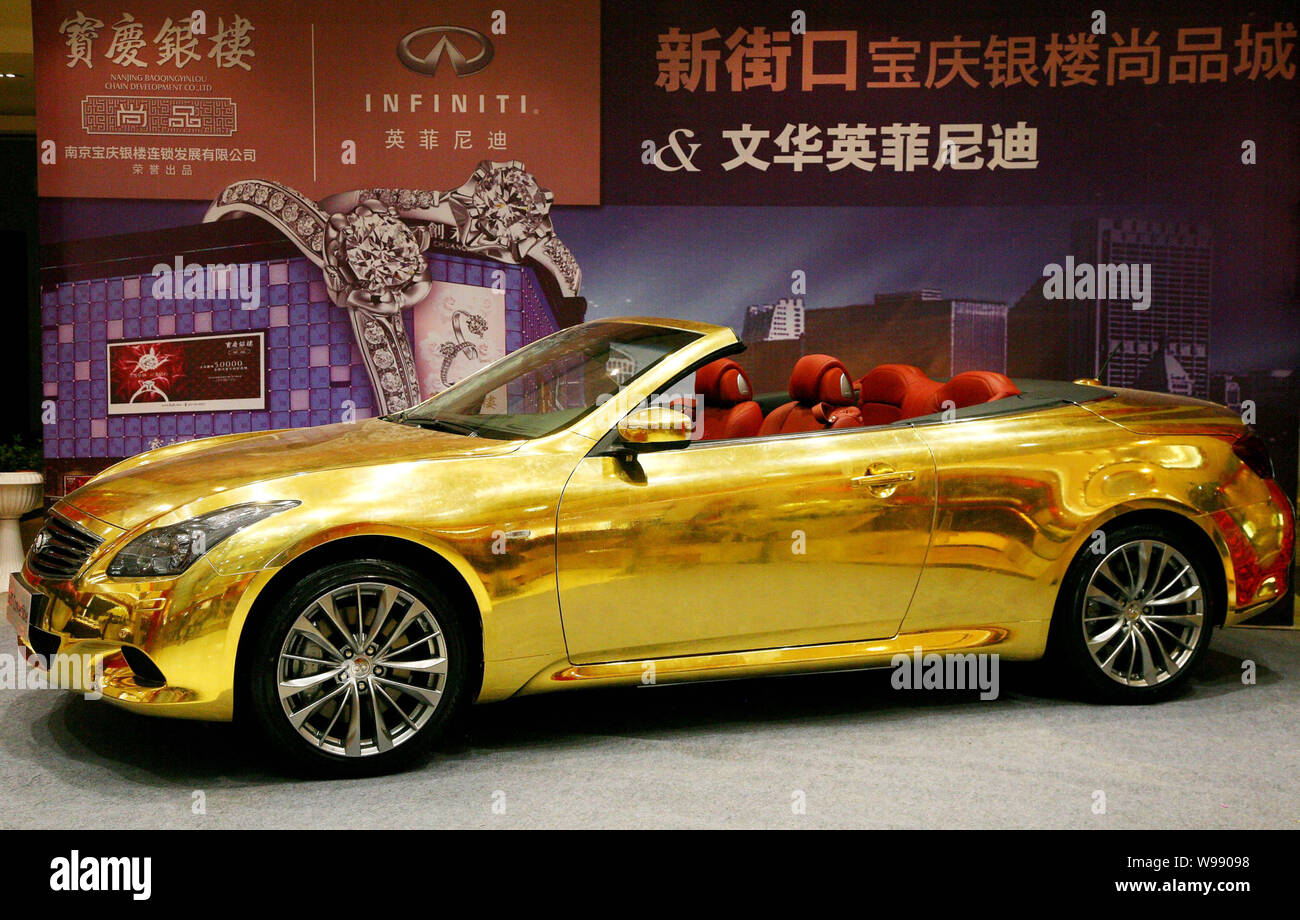 A gold Infiniti G37 Coupe Convertible is exhibited at a gold and jewel ...