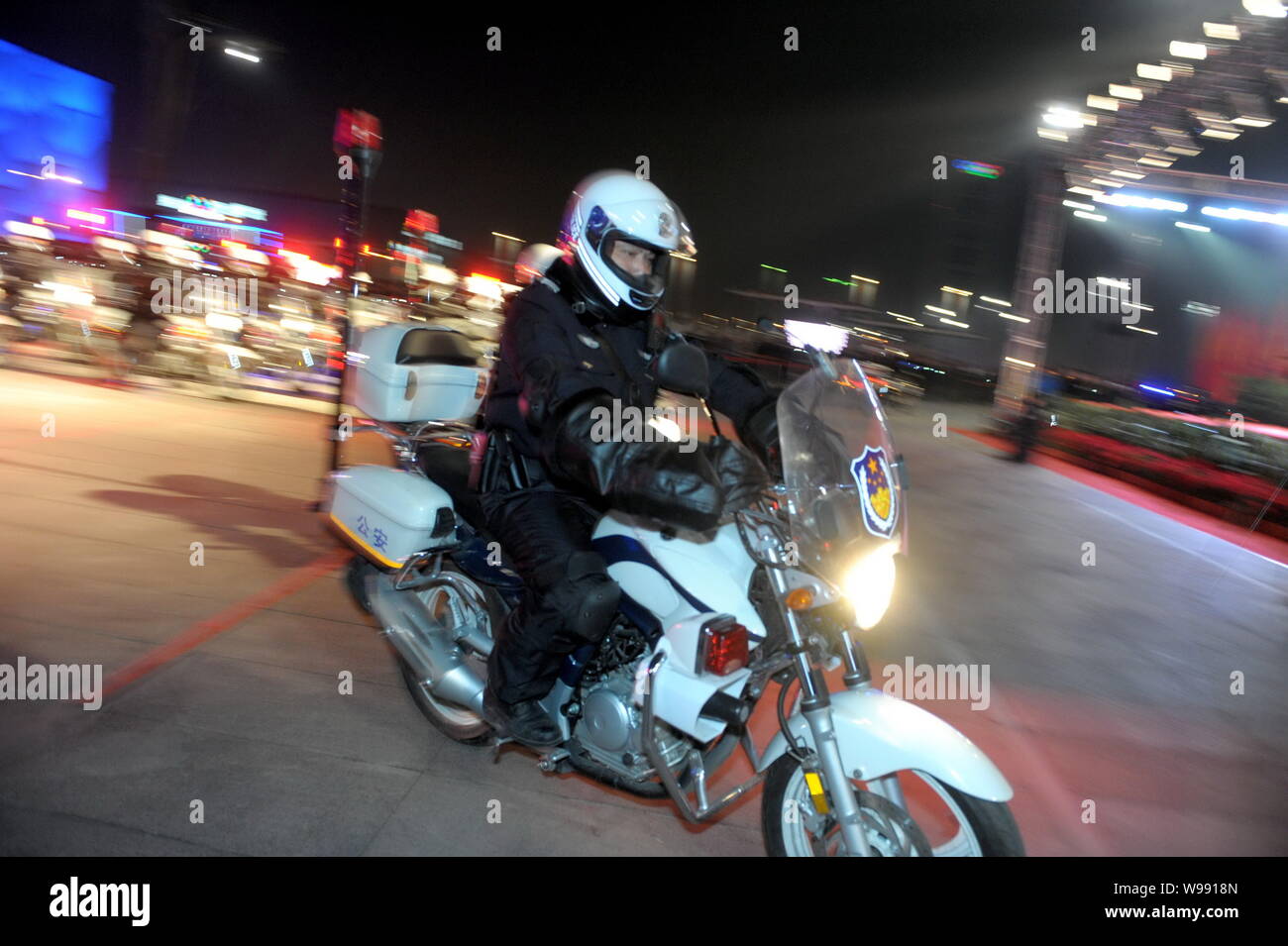 A motorcycle police officer is seen by the National Aquatic Center ...
