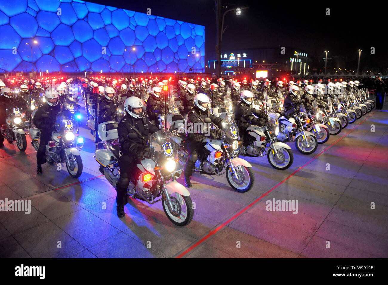 A team of motorcycle police officers are seen by the National Aquatic ...