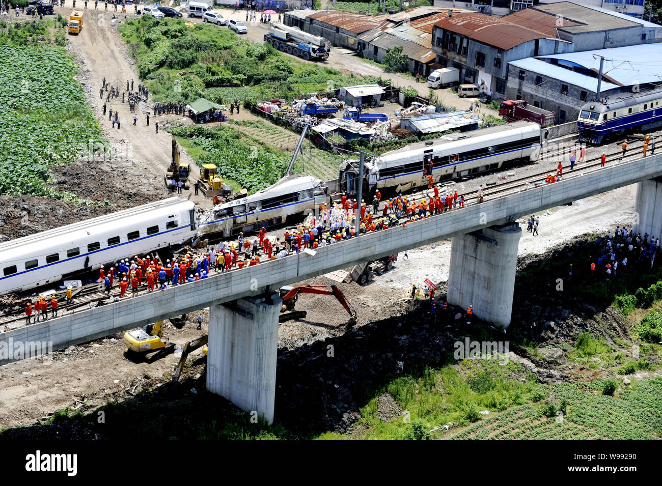 Aerial view of rescuers removing the wreckage of the coaches of two CRH ...