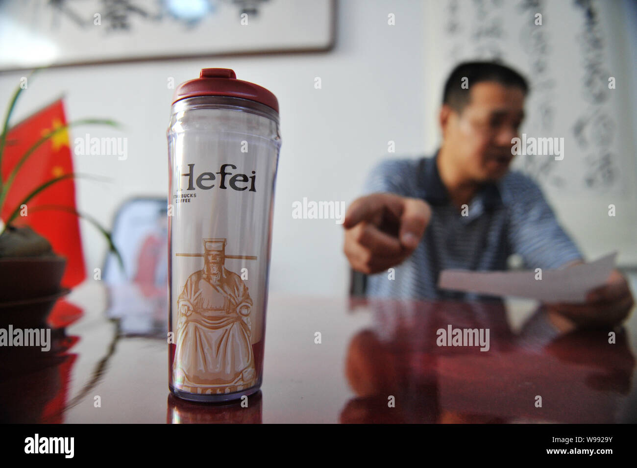 Bao XunAn, a descendant of ancient Chinese judge Bao Zheng, points to a ...