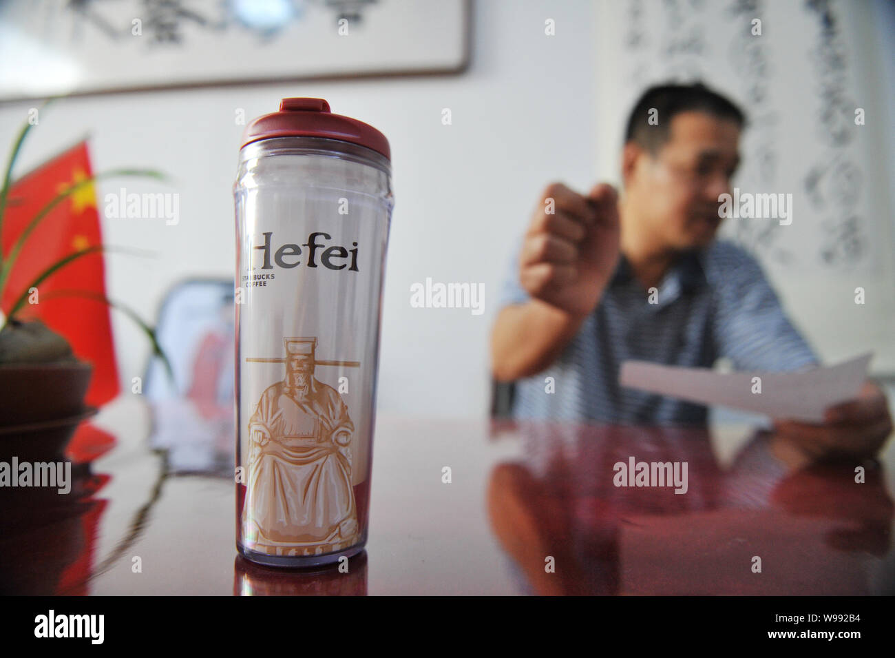 Bao XunAn, a descendant of ancient Chinese judge Bao Zheng, points to a ...