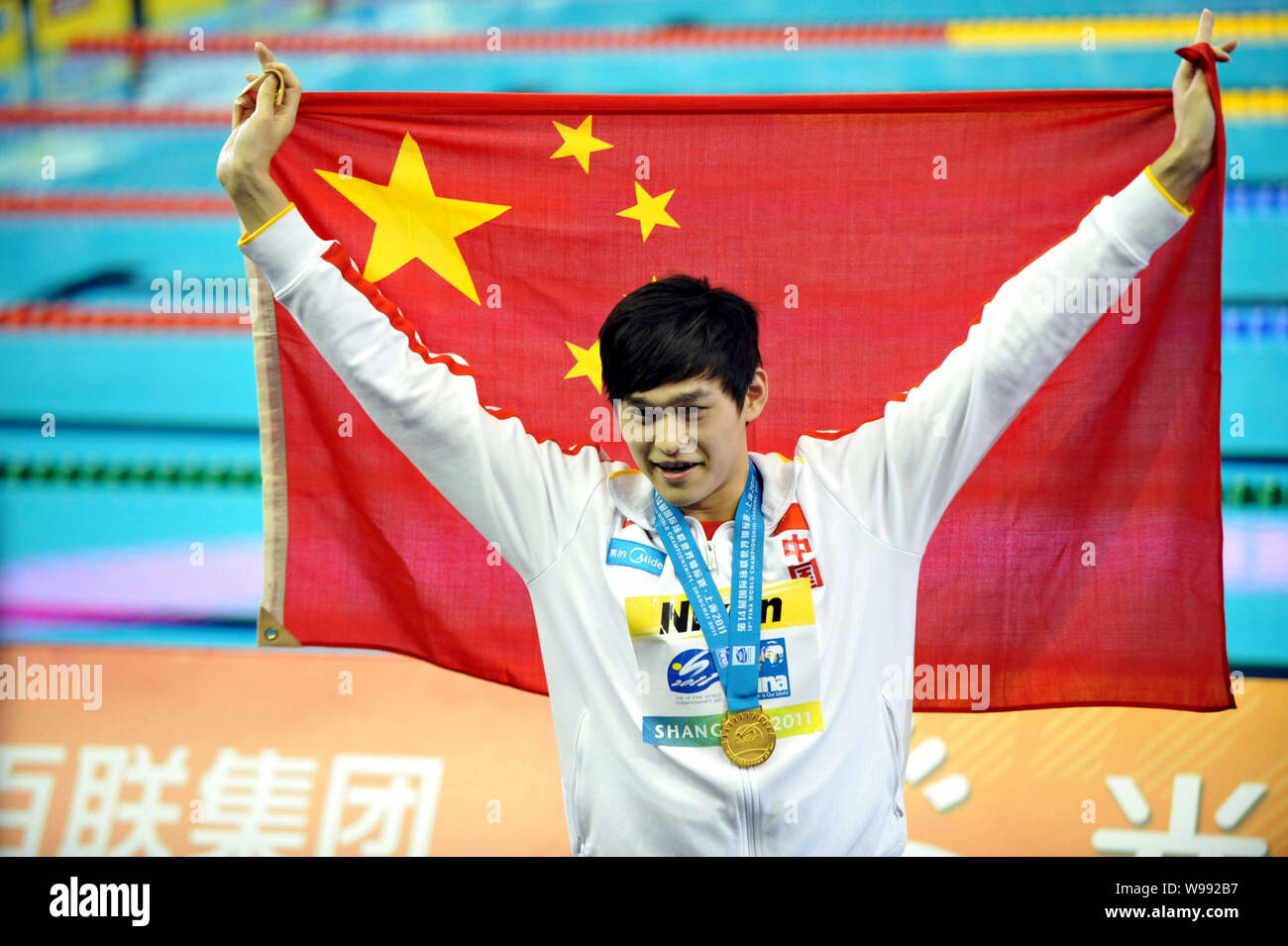 Gold medalist Sun Yang of China poses after the award ceremony for the ...