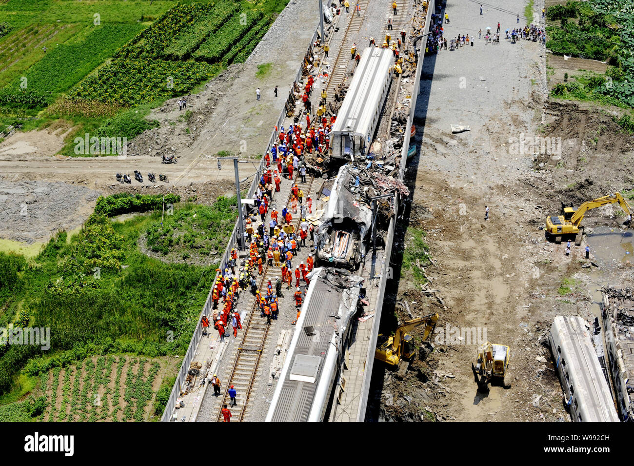 Aerial view of rescuers removing the wreckage of the coaches of two CRH ...
