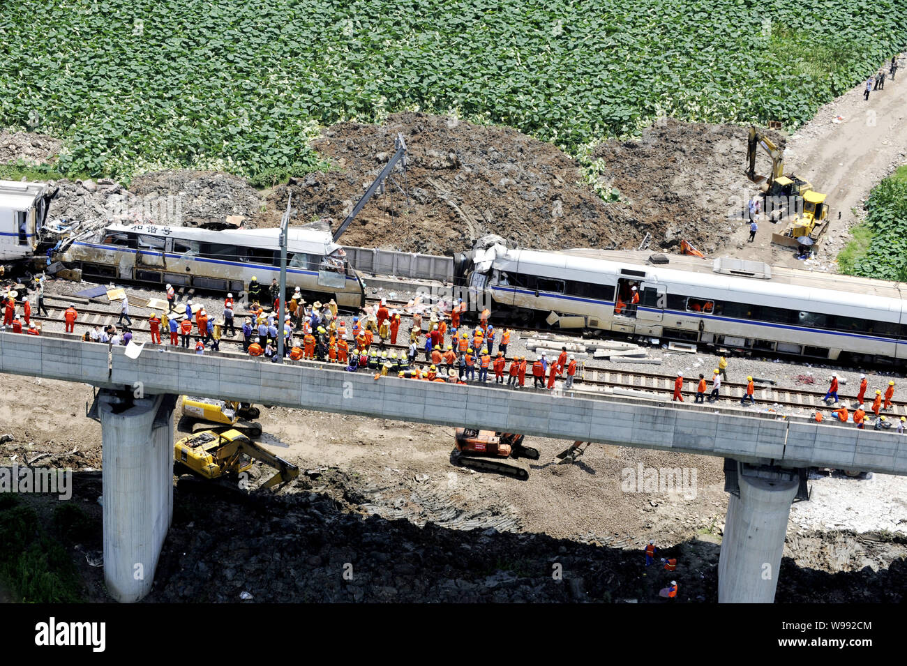 Aerial view of rescuers removing the wreckage of the coaches of two CRH ...