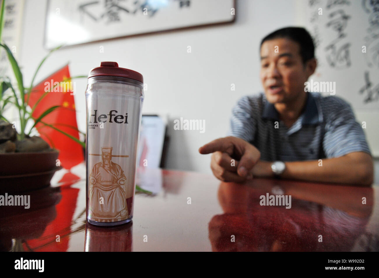 Bao XunAn, a descendant of ancient Chinese judge Bao Zheng, points to a ...