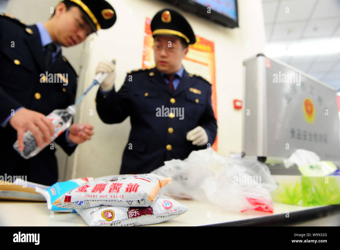--FILE--Chinese law enforcemen officers test food additives at a ...