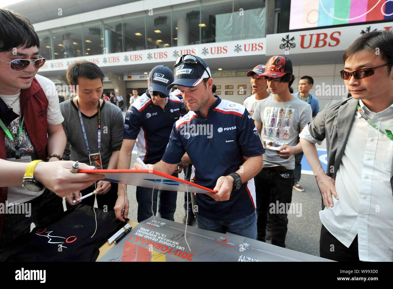 Brazilian F1 driver Rubens Barrichello of the Williams team signs for a ...
