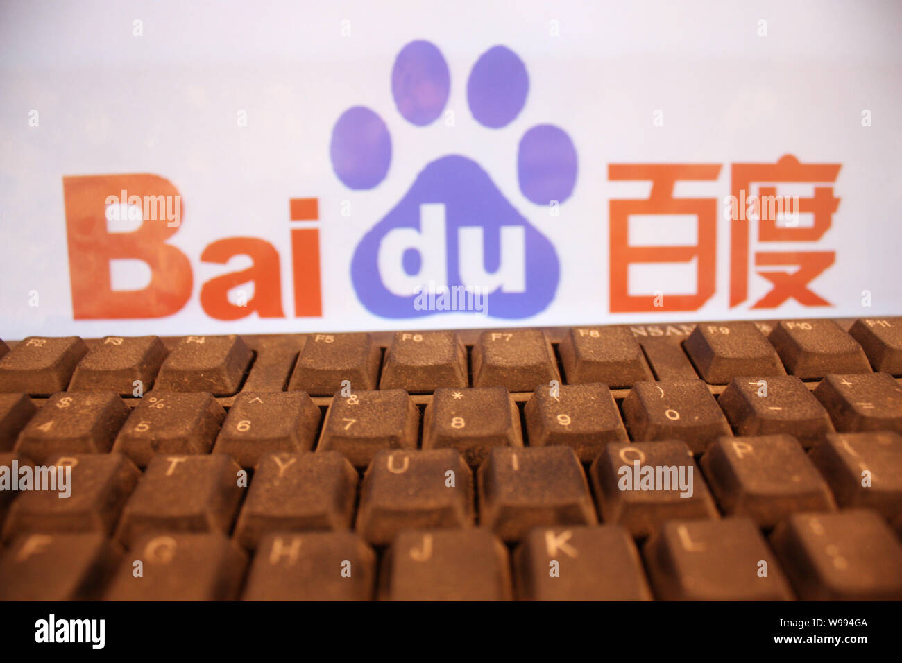 A computer keyboard is pictured in front of the screen shot of the ...