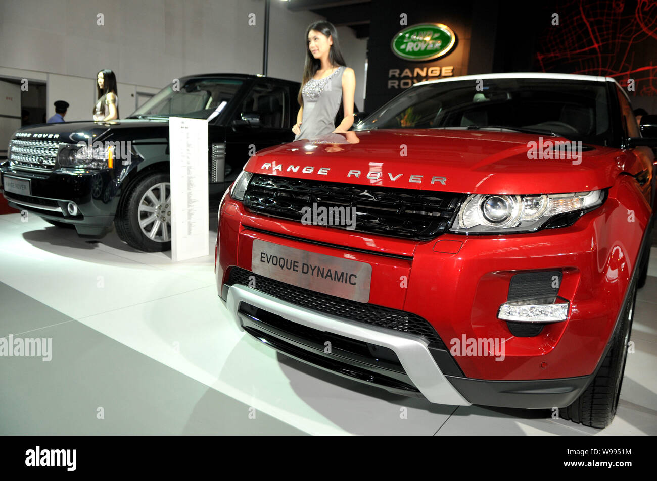 --File--Models pose by Land Rover SUVs during an auto show in Taizhou ...